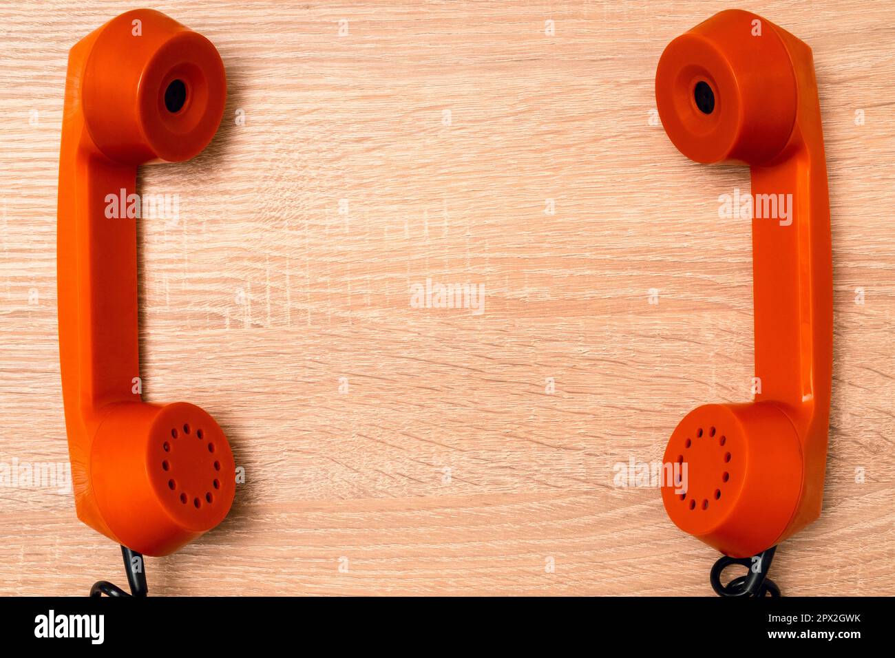 Two telephone handsets facing each other and talking. Copy space Stock ...