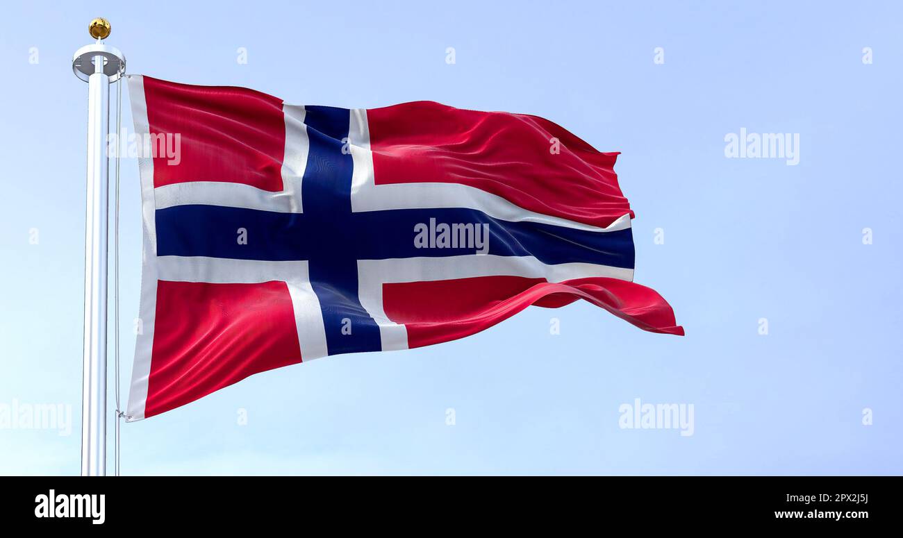 Norway national flag waving in the wind on a clear day. Red field with ...