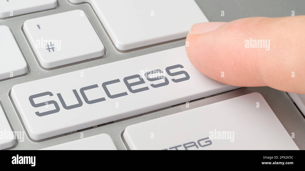 A keyboard with a labeled button - Success Stock Photo - Alamy