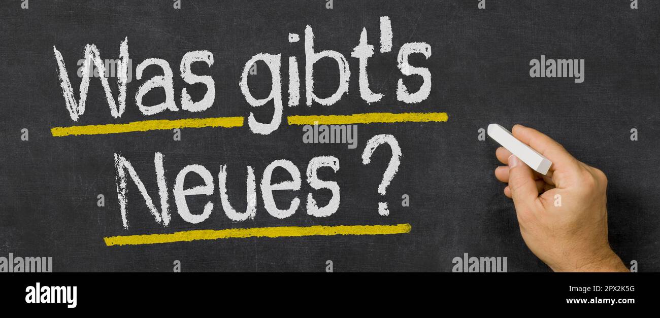 Text written on a blackboard - What's new in german - Was gibt es Neues ...