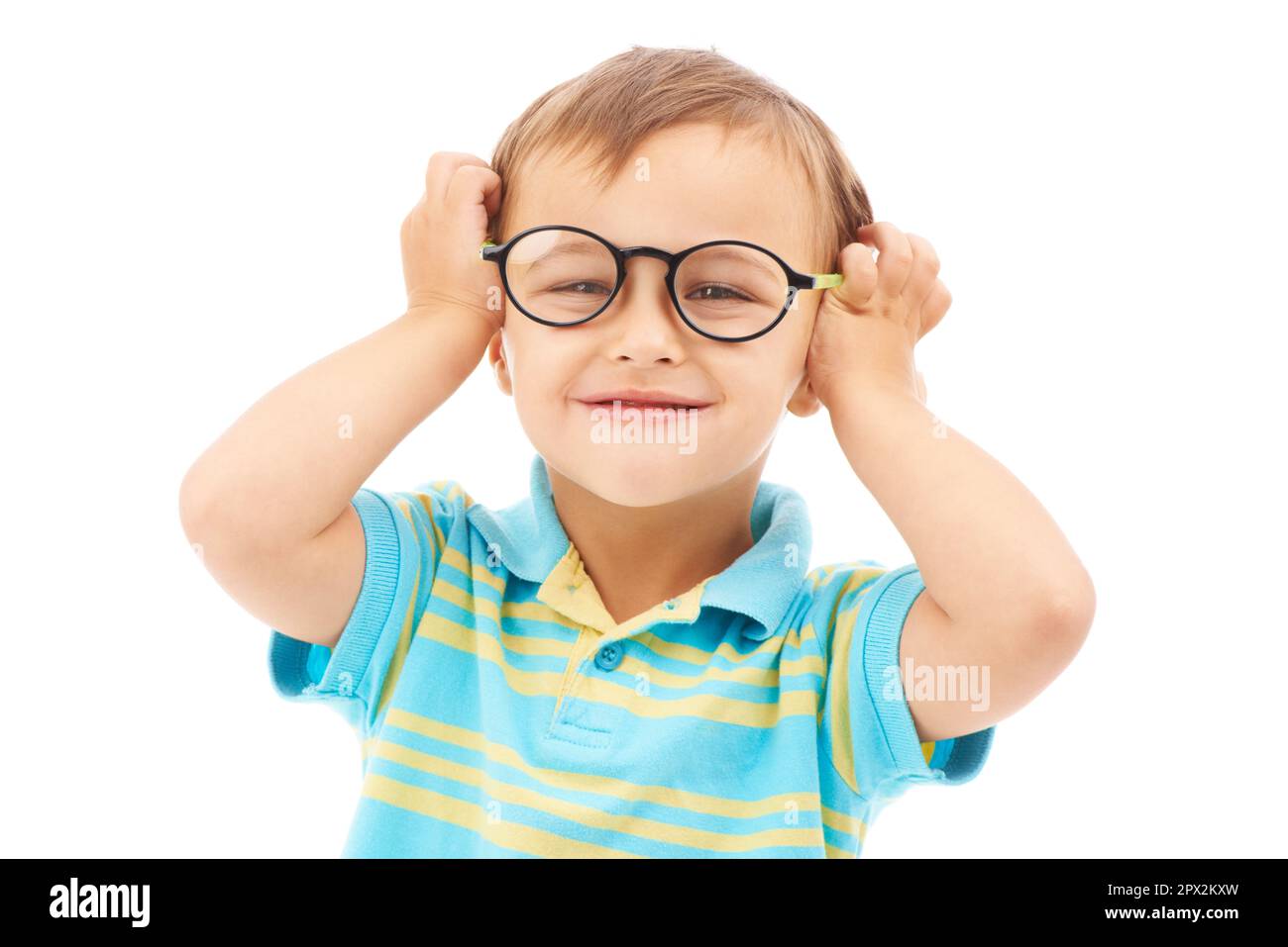 Liking my new specs. Studio portrait of a young boy wearing glasses ...