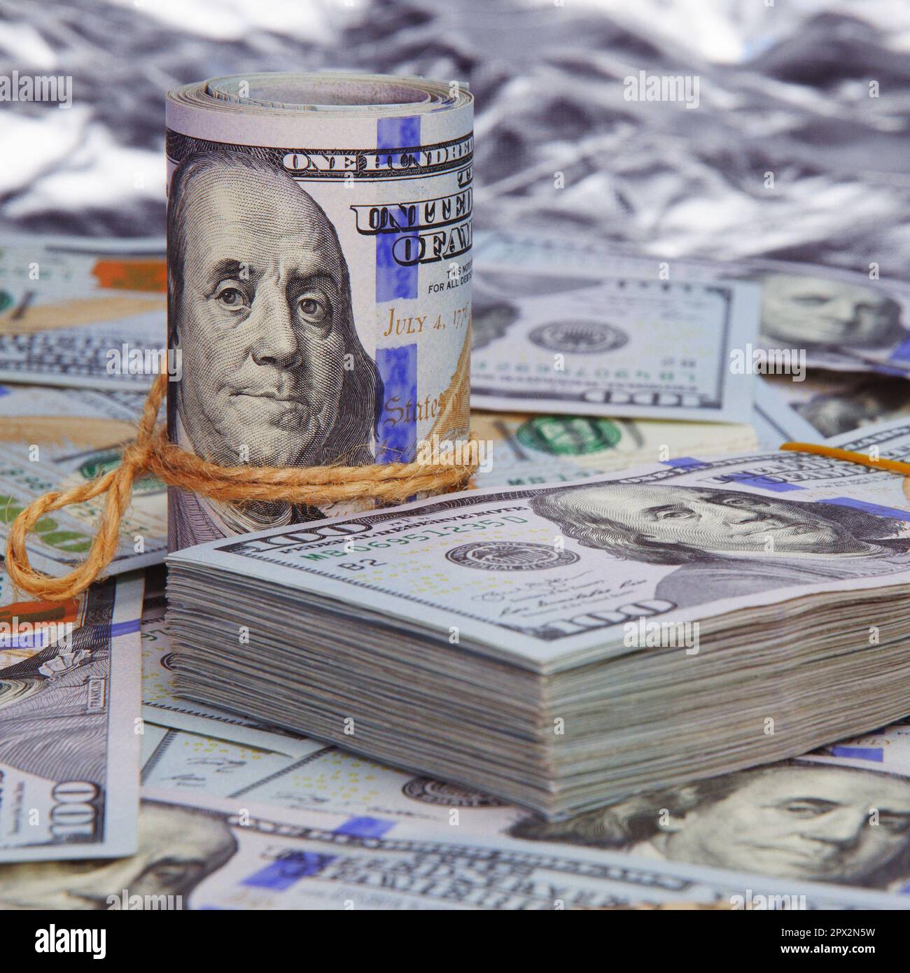 Cash hundred dollar bills, dollar background image. A stack and roll of ...