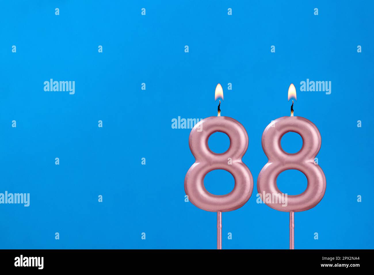 Candle number 88 - Birthday in blues foamy background Stock Photo - Alamy