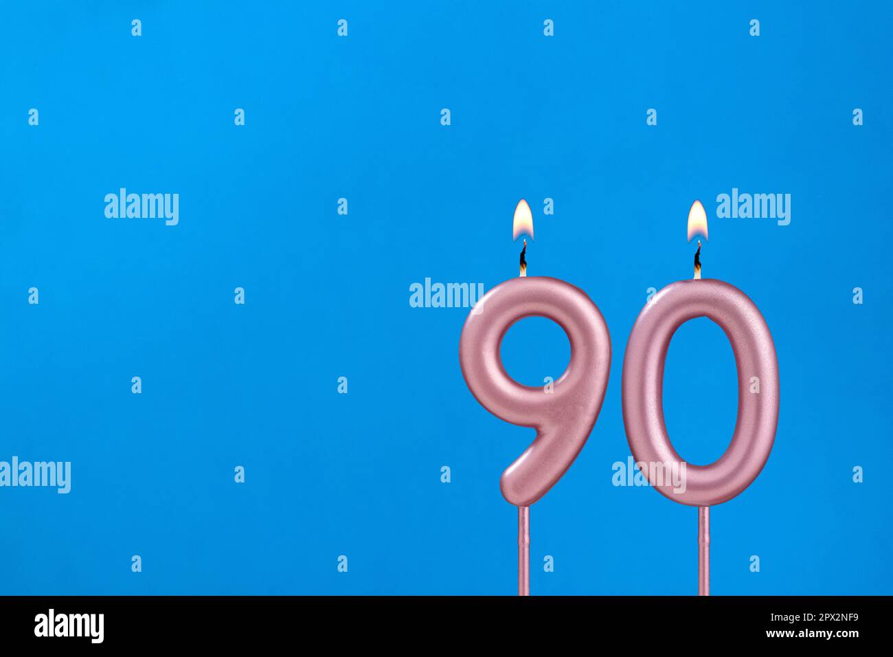 Candle number 90 - Birthday in blues foamy background Stock Photo - Alamy