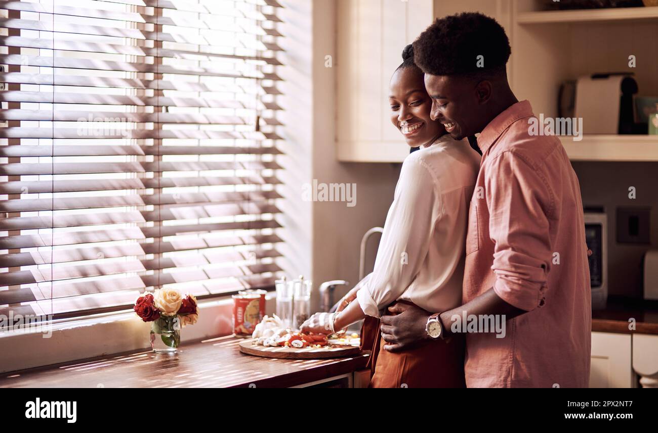 Starving Already An Affectionate Young Man Hugging His Wife While Shes