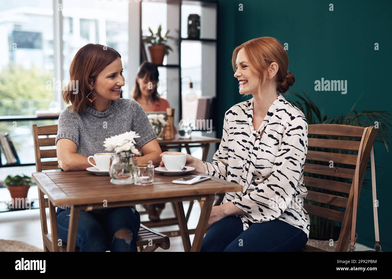 Two middle aged women friends smiling hi-res stock photography and ...