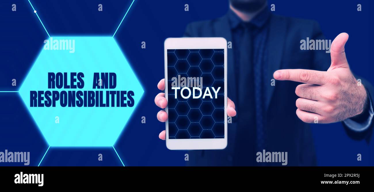 Hand writing sign Roles And Responsibilities, Concept meaning Business ...