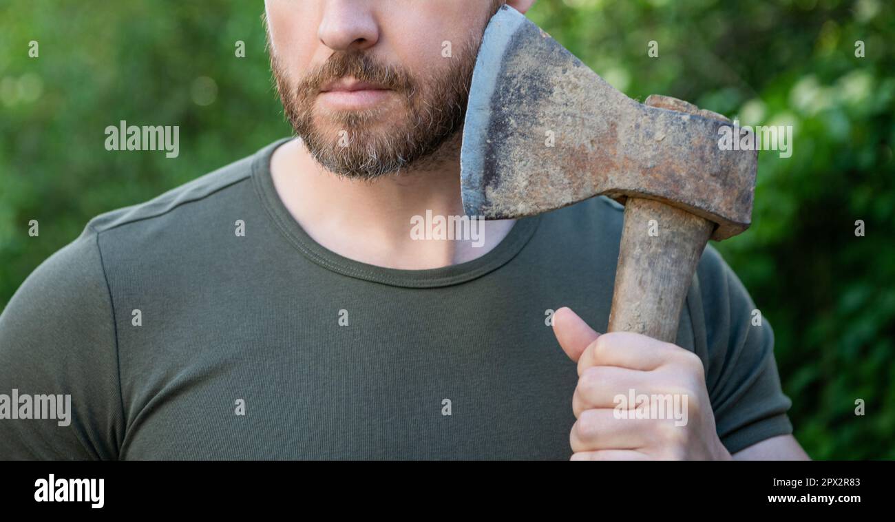cropped photo of masculine guy with axe. masculine guy with axe ...