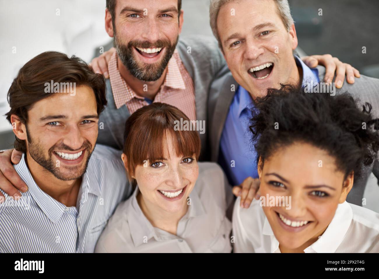 We like to keep work positive. Portrait of a group of positive-looking ...