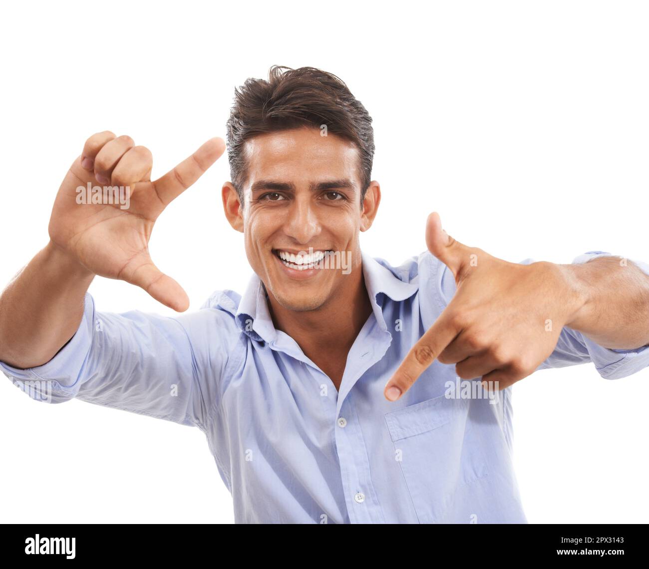 Finding the perfect frame. Portrait of a handsome young man smiling and ...
