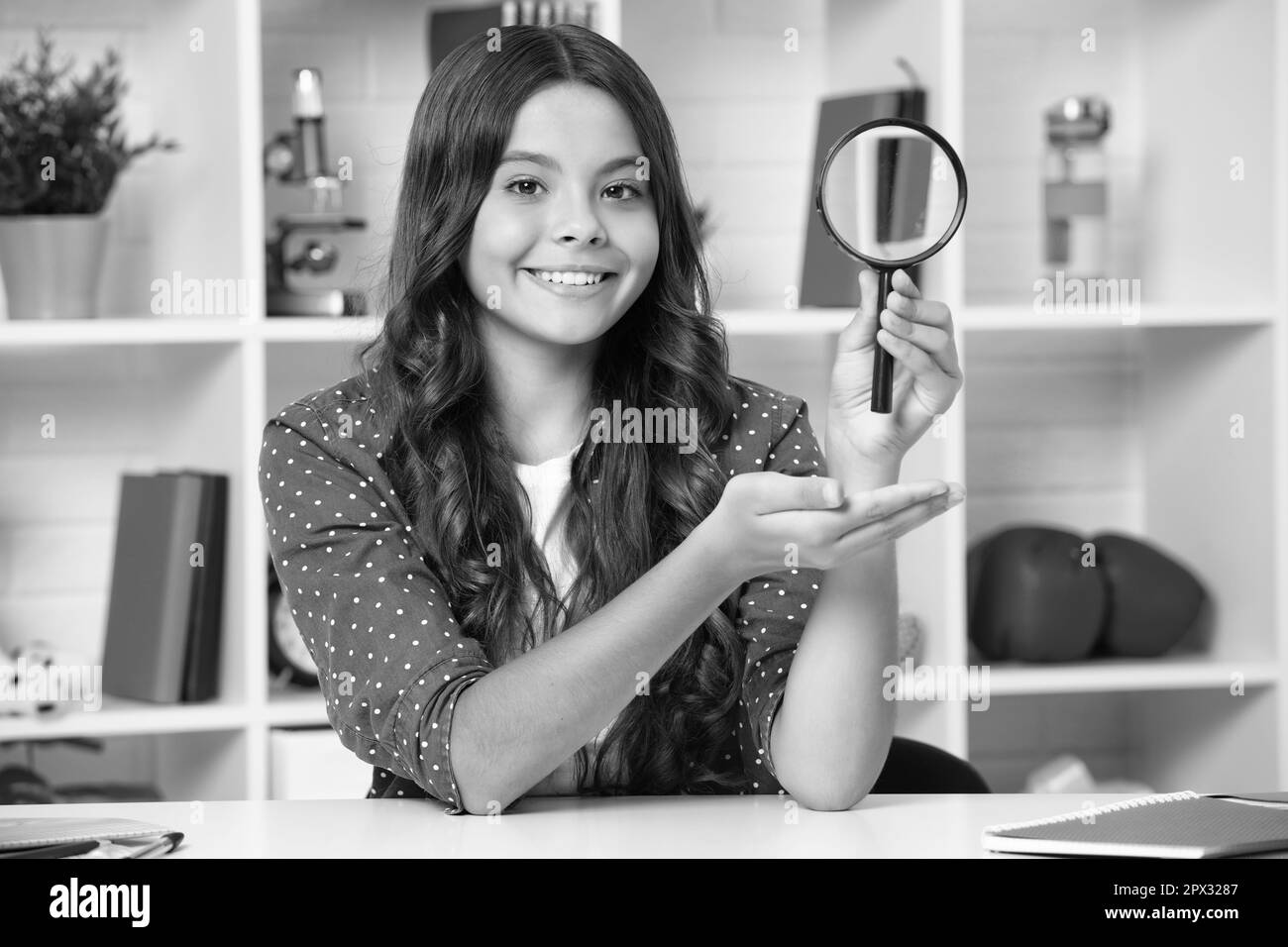 Teen school girl with magnifying glass, knowledge. Happy schoolgirl ...