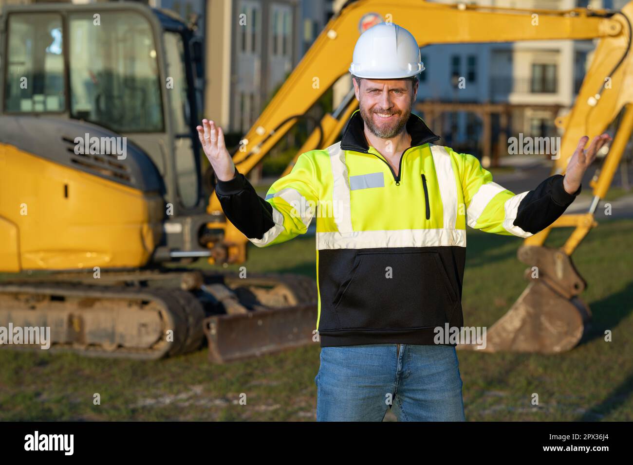 Builder in helmet on the construction site Stock Photo - Alamy