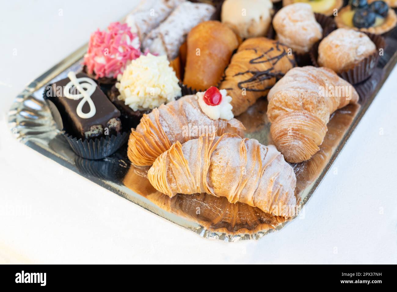 Assortment of delicious and colorful pastries, made by pastry chef. All ...