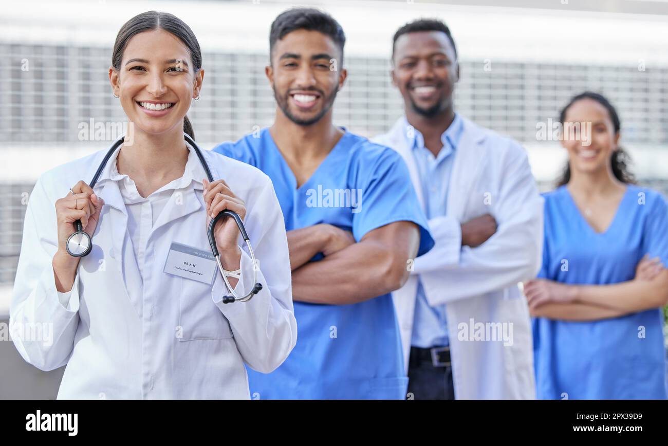 Shot of a group of doctors standing against a city background Stock ...
