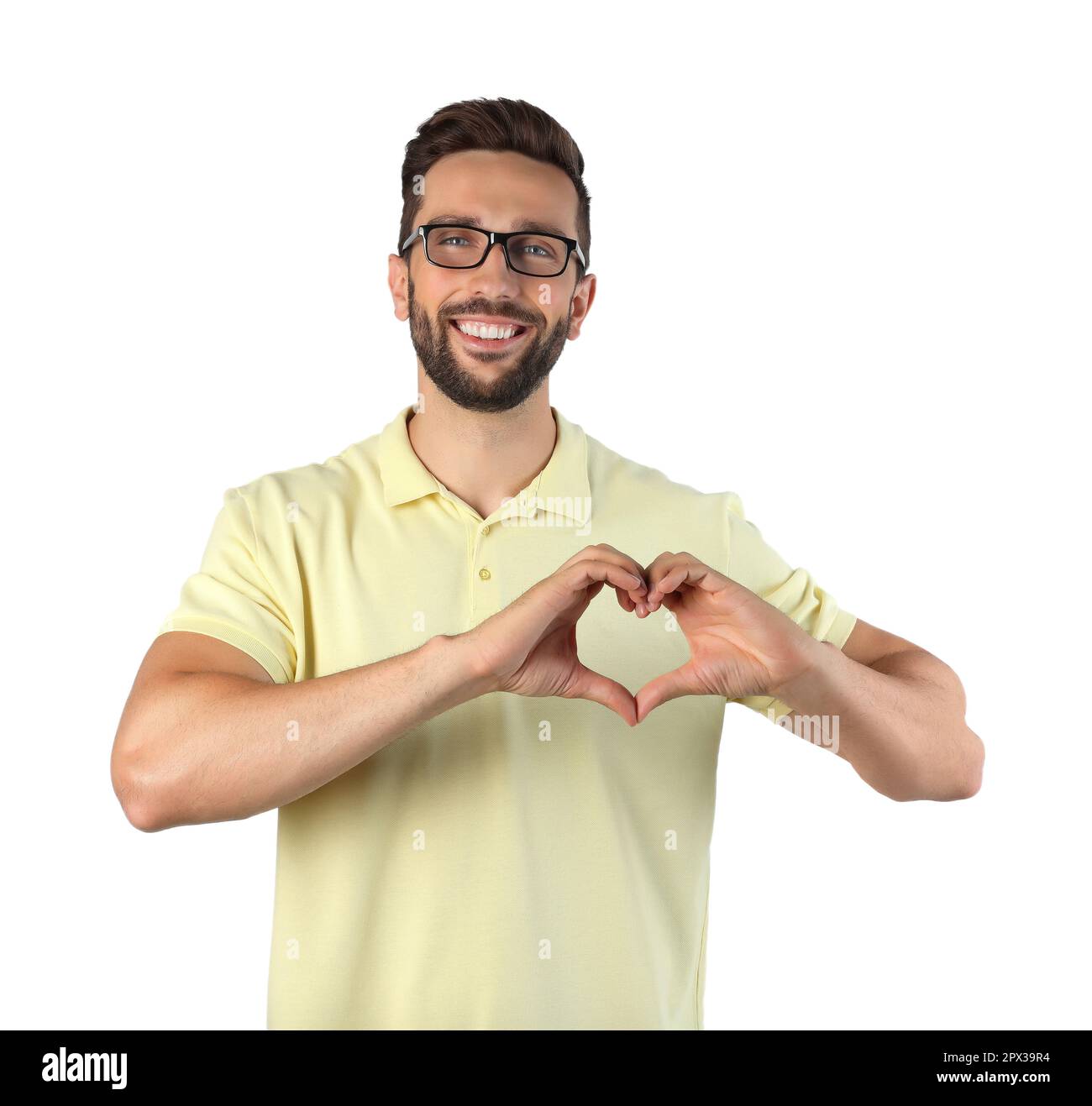 Happy man making heart with hands on white background Stock Photo - Alamy