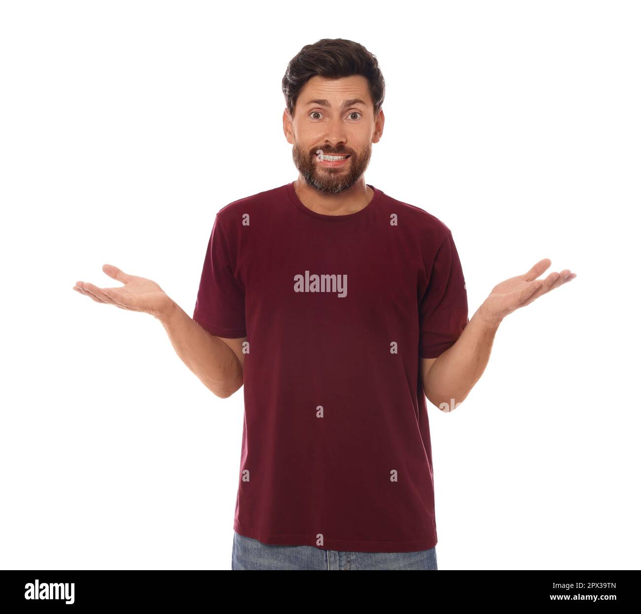 Embarrassed man in shirt on white background Stock Photo - Alamy