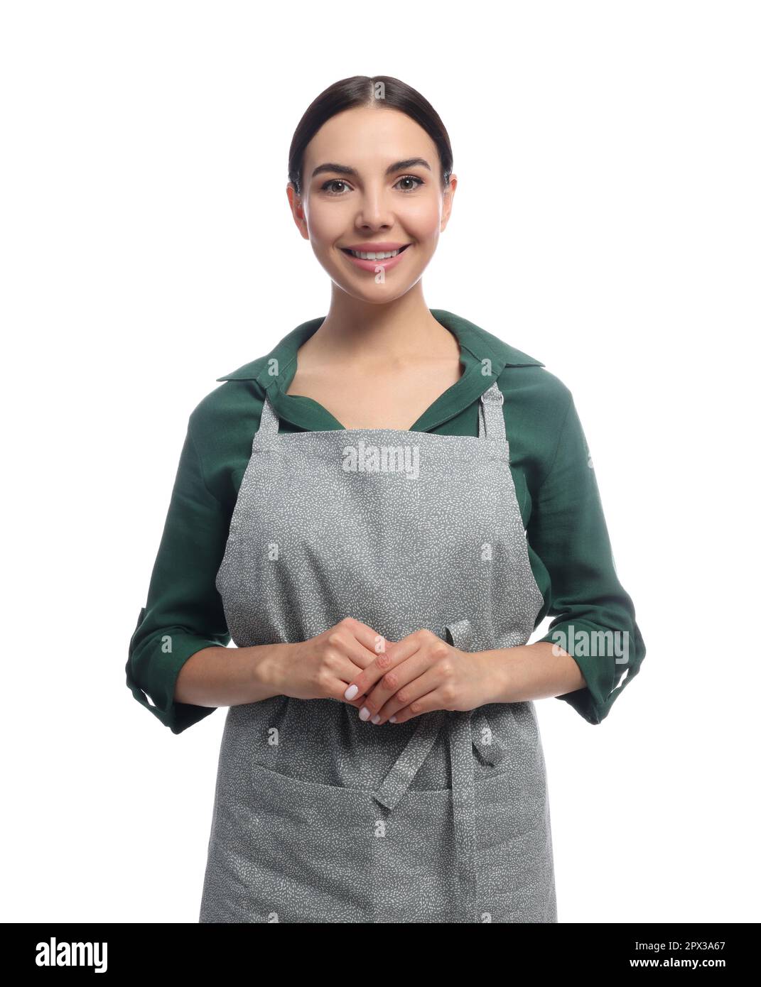 Young woman in grey apron on white background Stock Photo - Alamy