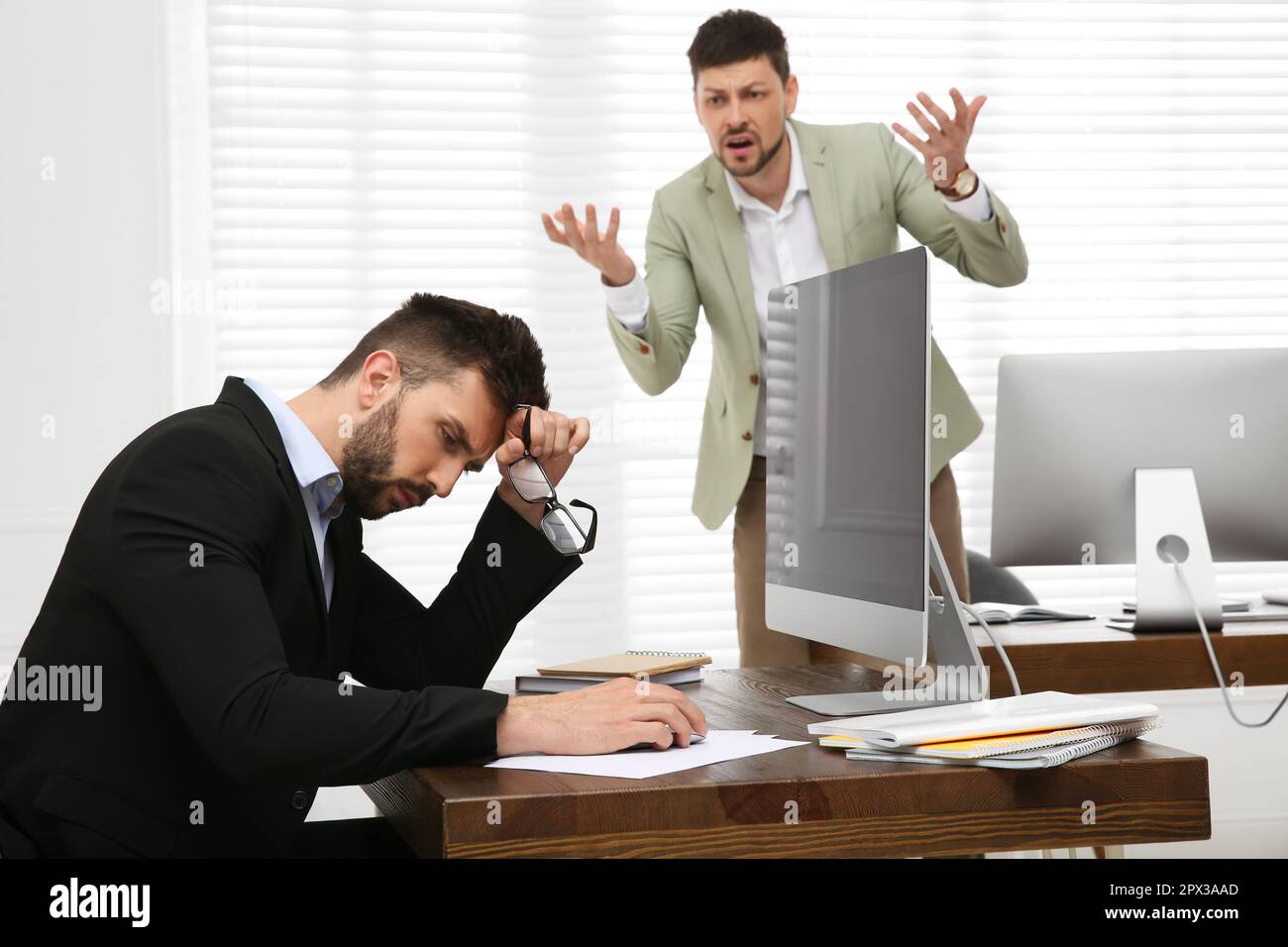 Boss screaming at employee in office. Toxic work environment Stock ...