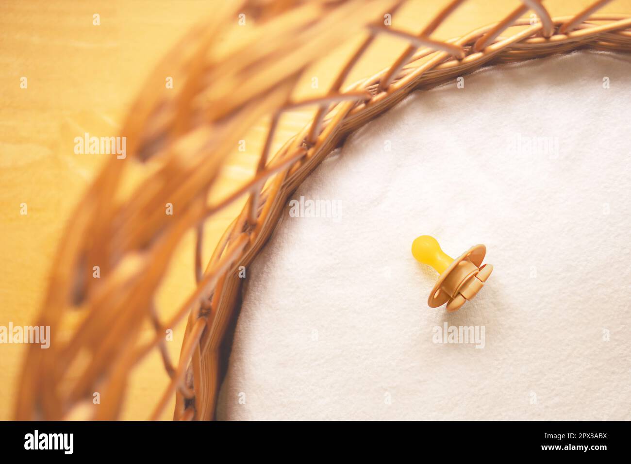 Baby pastel pacifier on a white background in baby basket Stock Photo ...