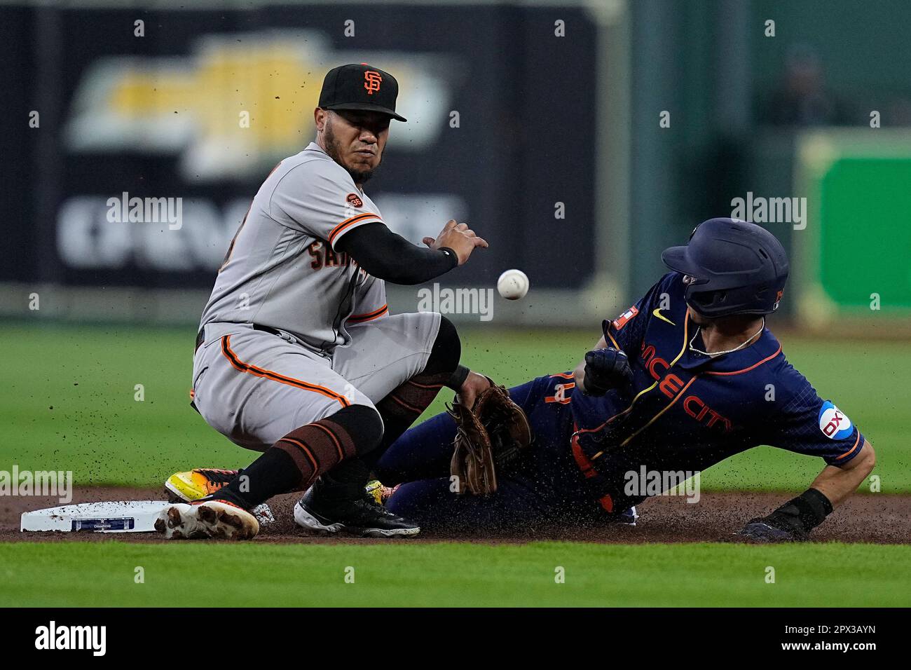 San Francisco Giants shortstop Thairo Estrada, left, misses a throw as ...