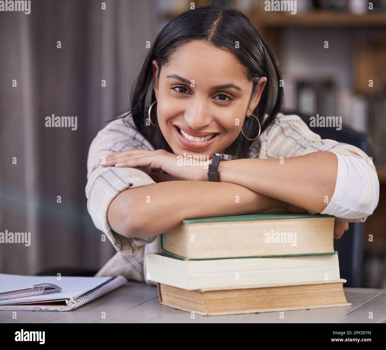 Miss independent...Almost. a young student doing her homework at the ...