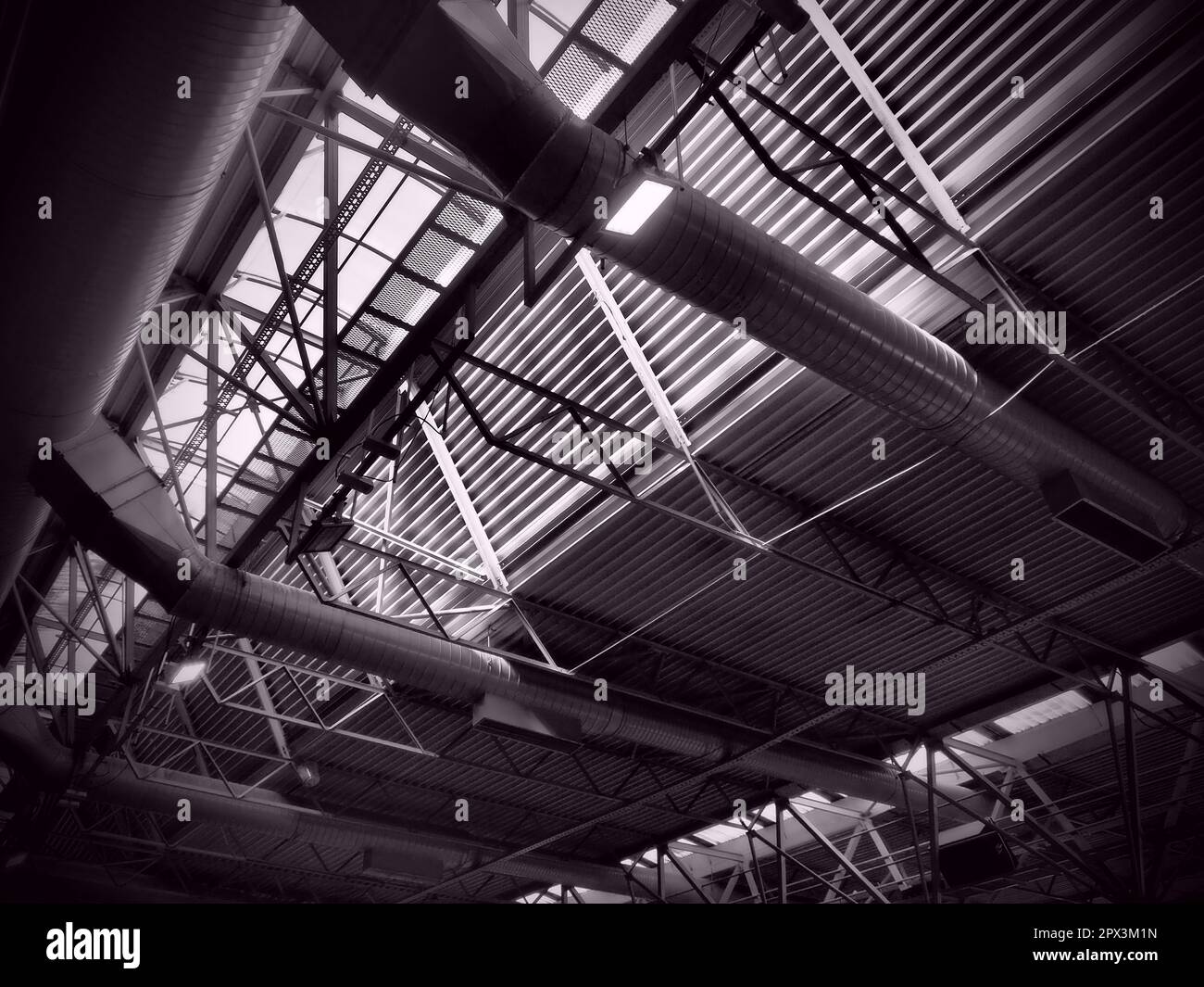 The roof of a hangar, a production hall or a sports hall. Metal ...