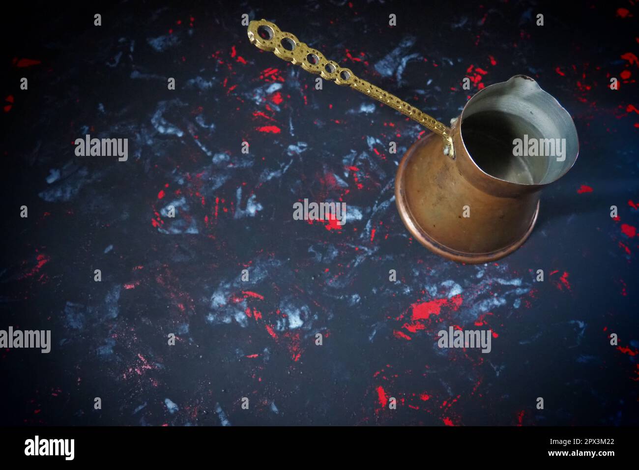Balkan cezve for turkish coffee. A copper cezve on black surface ...