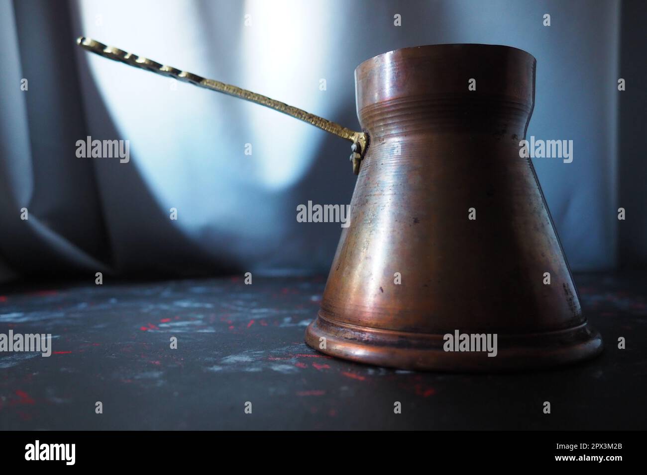 Balkan cezve for turkish coffee. A copper cezve on black surface ...