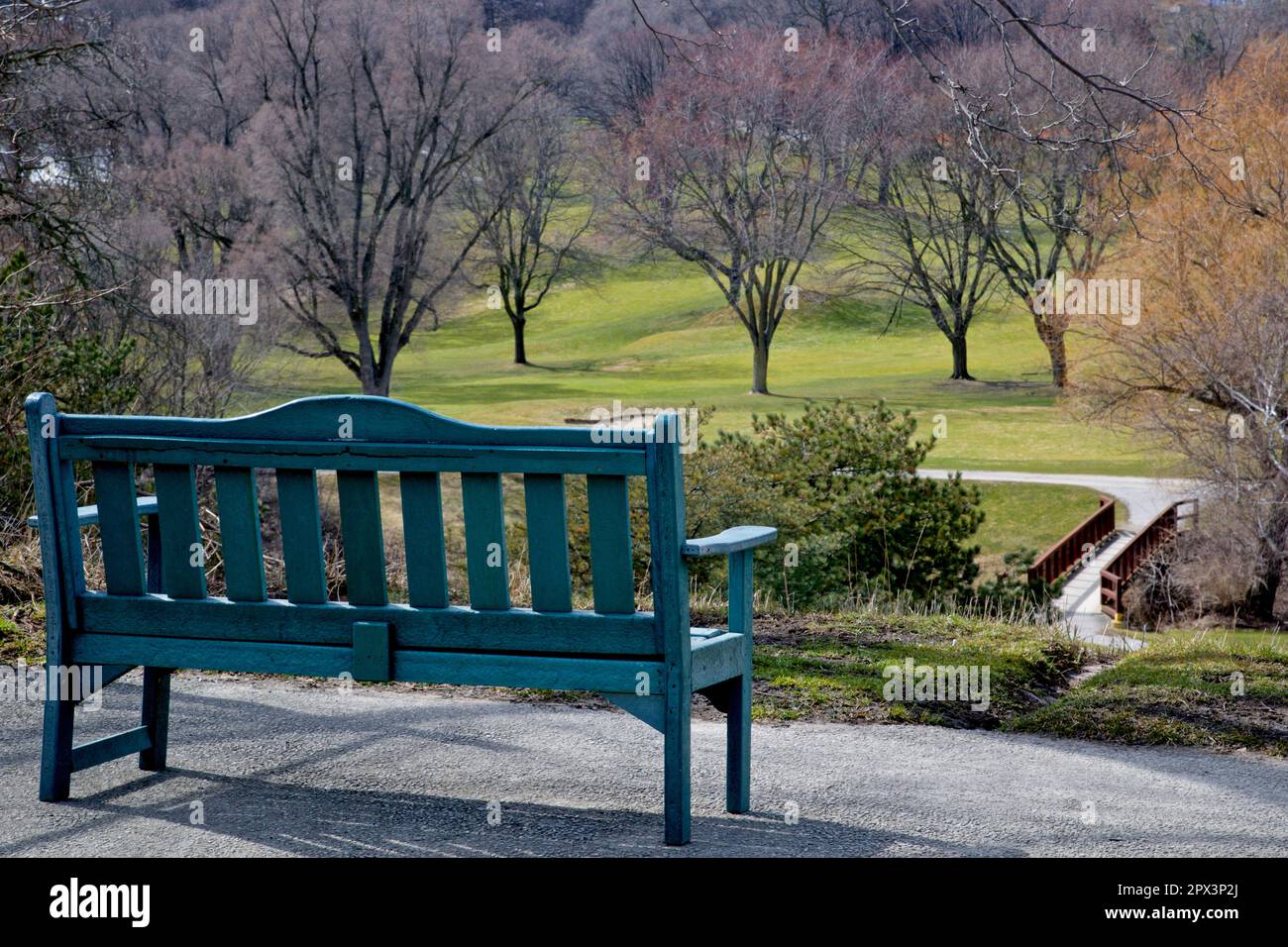 High-angle view of the golf course with a park bench Stock Photo - Alamy