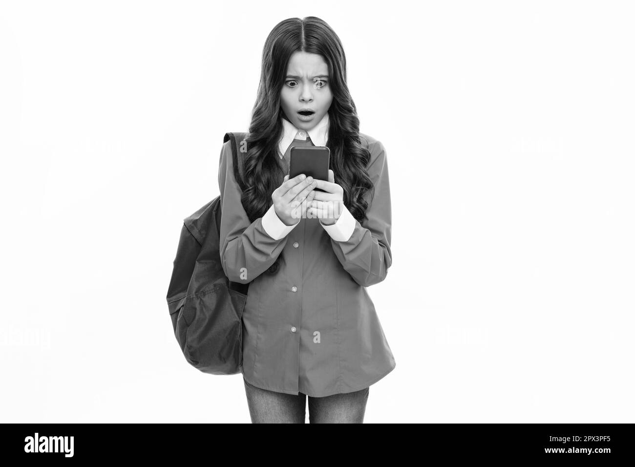 Schoolgirl student with school bag using smart phone. School uniform ...