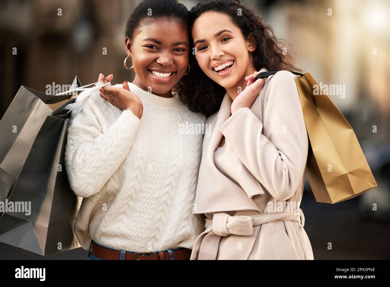 Give us a good bargain any day. Portrait of two young women shopping ...