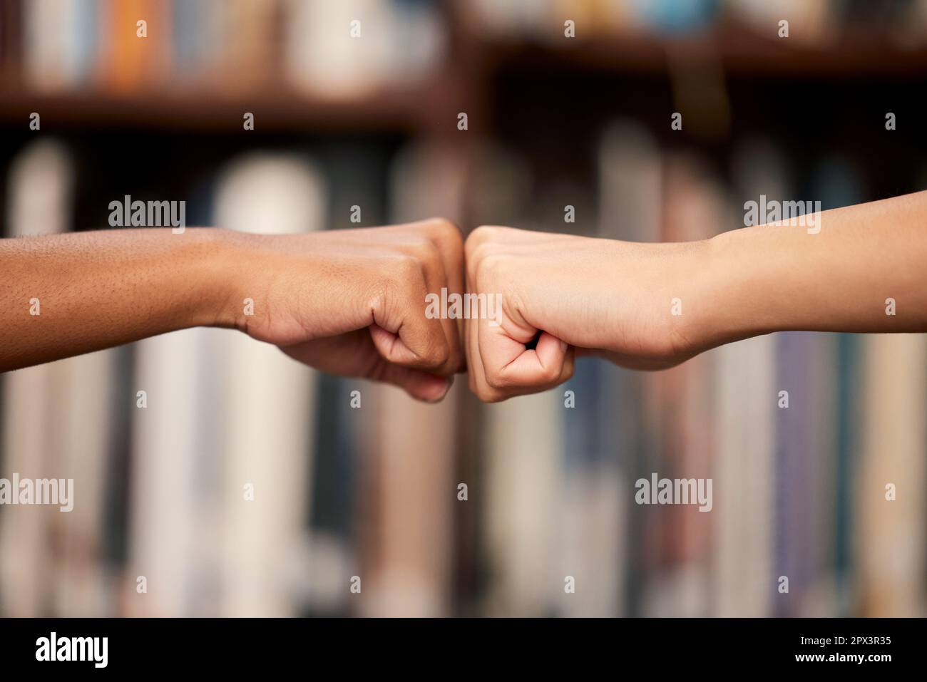 Were going to achieve great things. two unrecognizable people giving ...