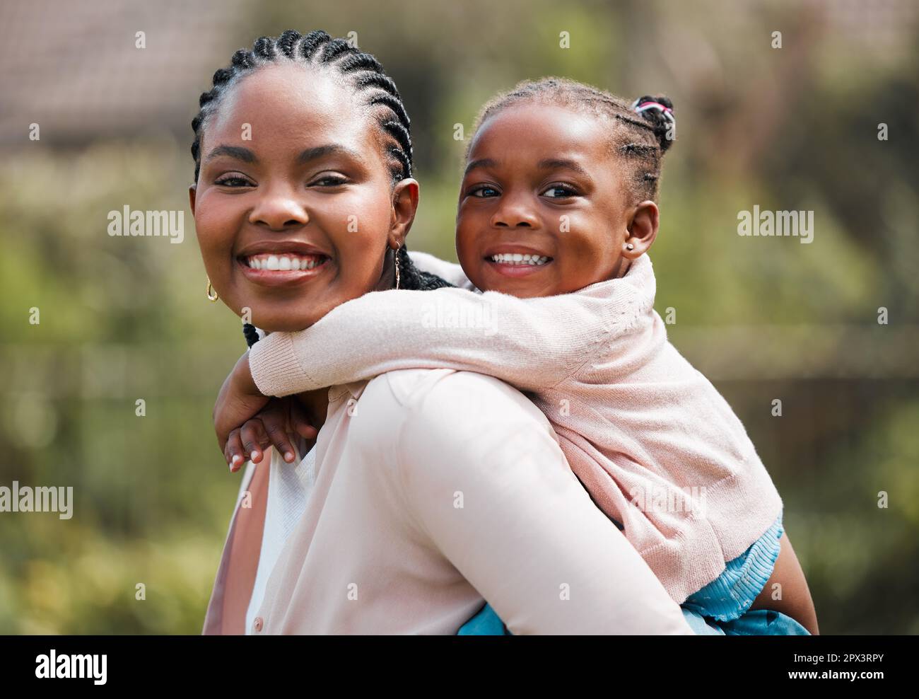 She is the spitting image of her mother. a woman giving her daughter a ...