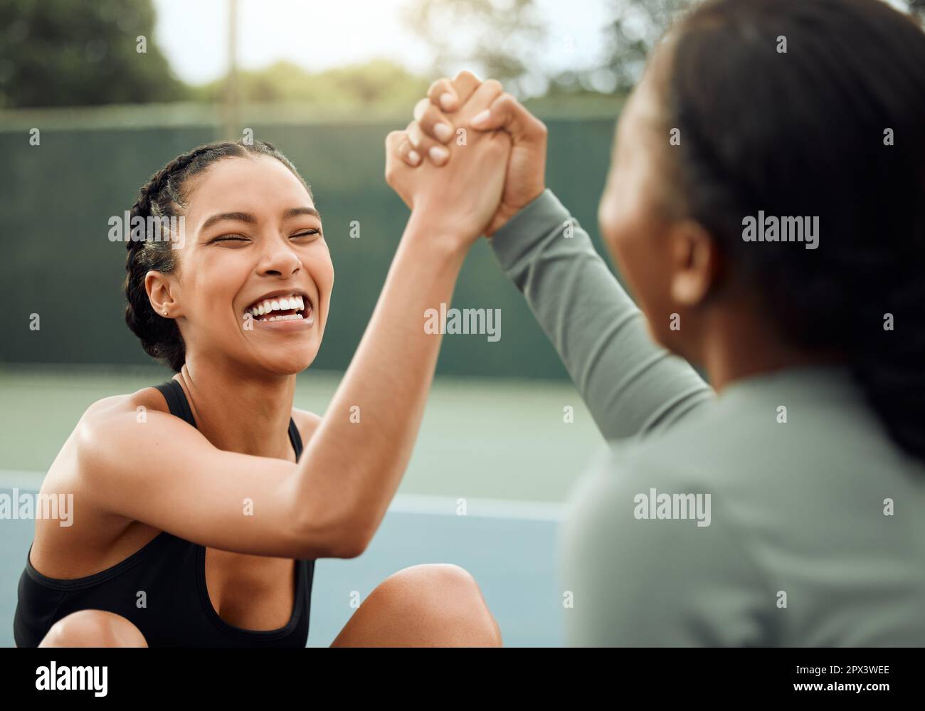 We smashed it today. two attractive young female athletes cheering ...