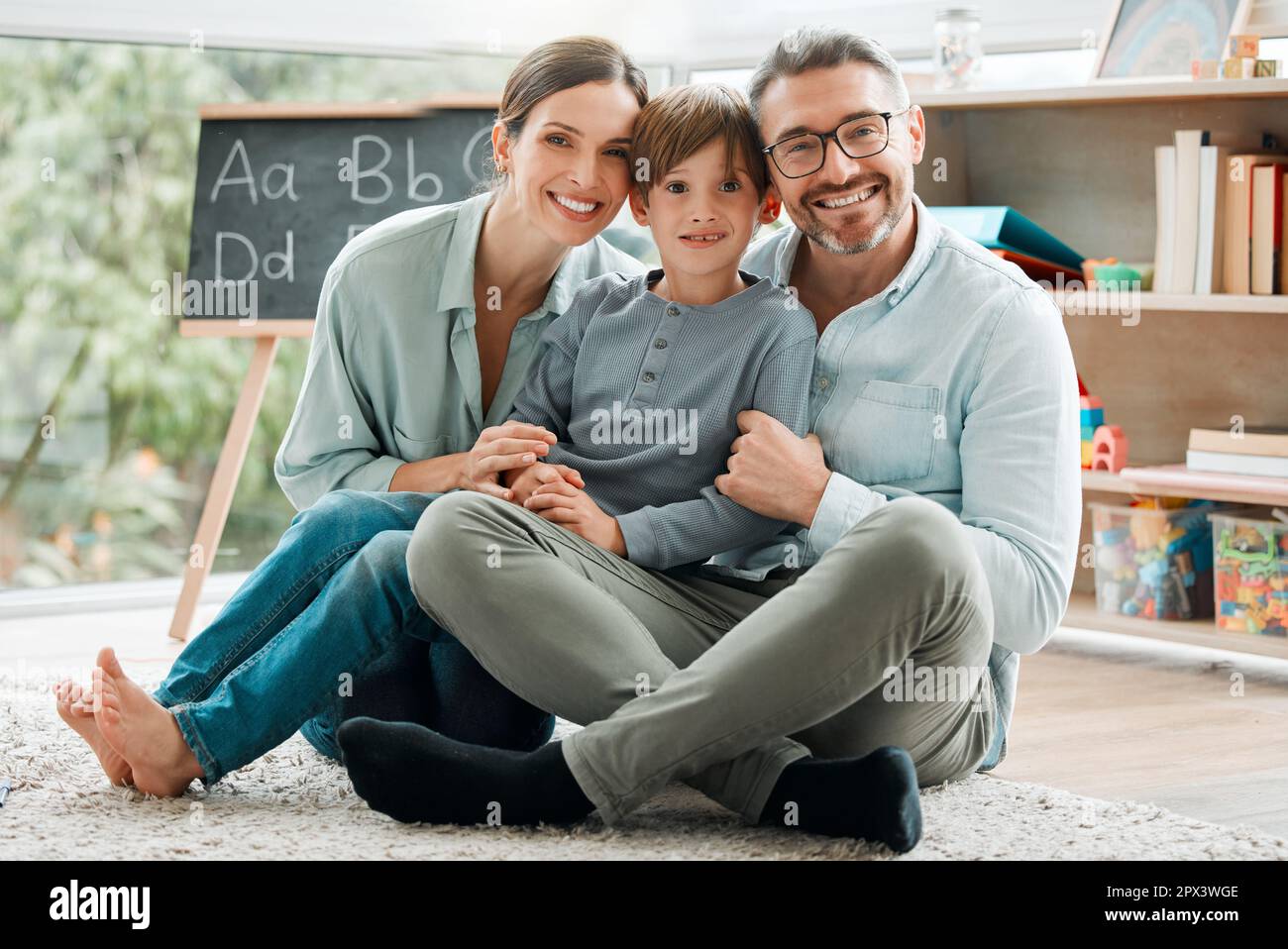 The family is one of natures masterpieces. two parents playing with ...
