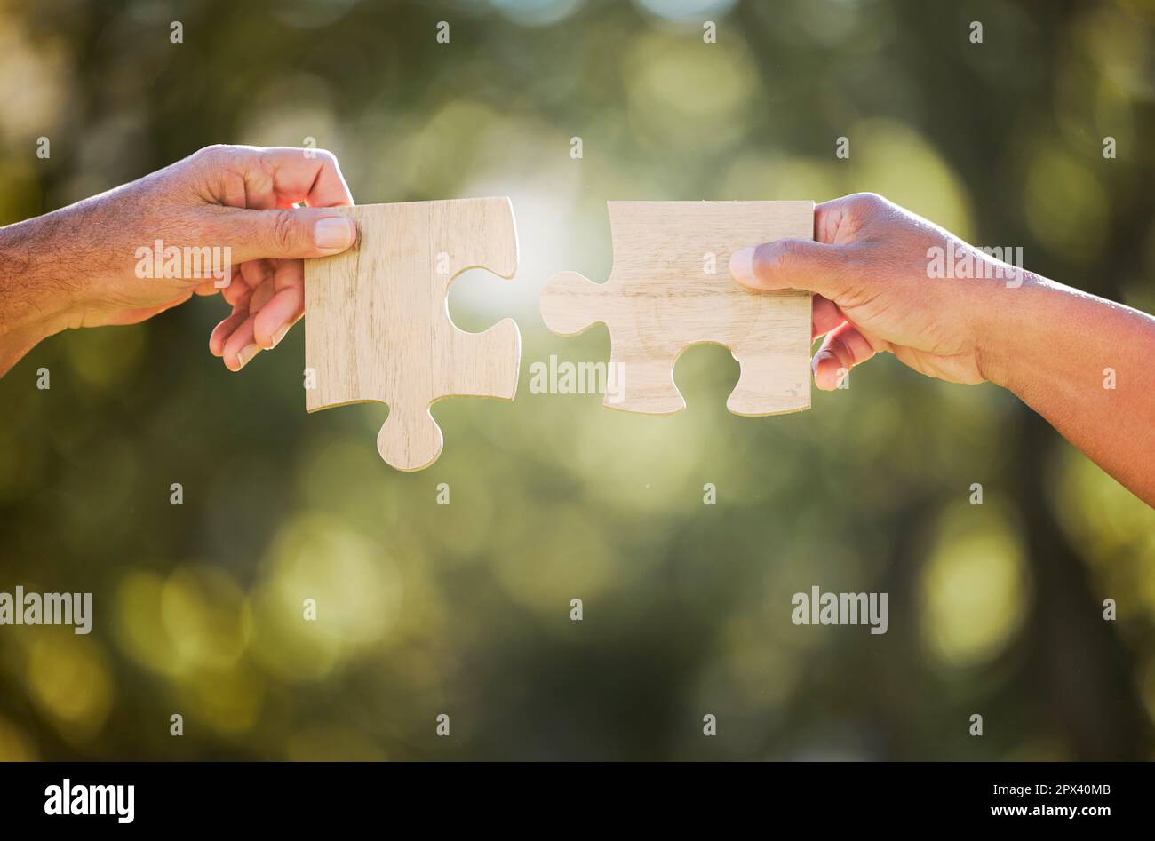 Joining forces for better results. two unrecognisable men completing a ...