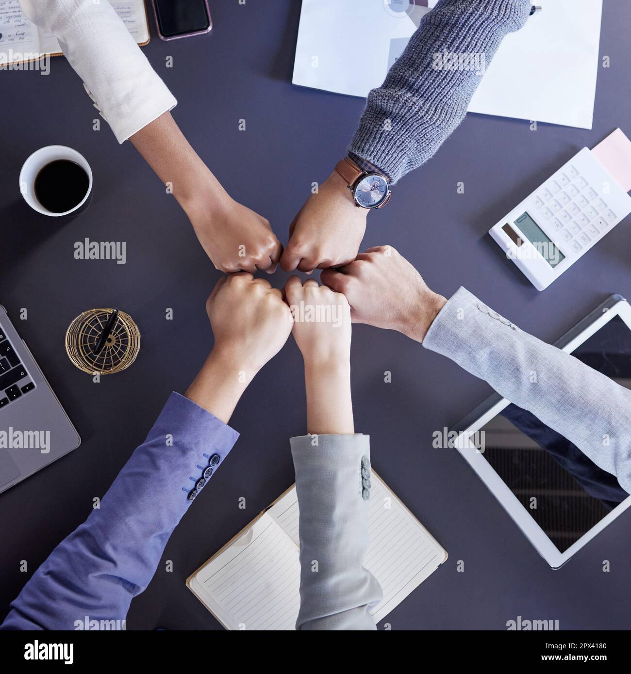 Taking a chance. a group of unrecognizable businesspeople giving each ...