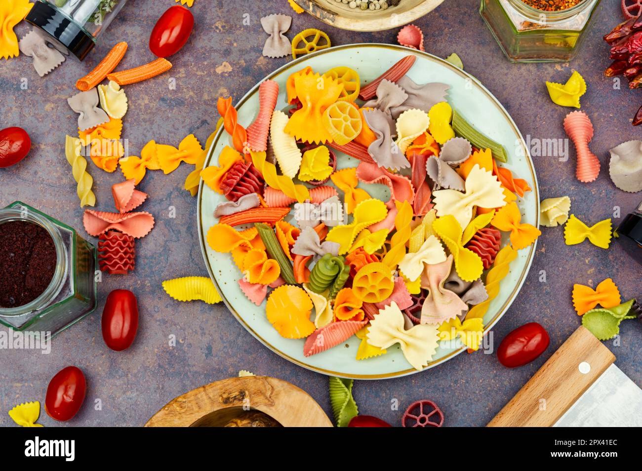 Colorful italian raw pasta on plate. Different types of Italian pasta ...