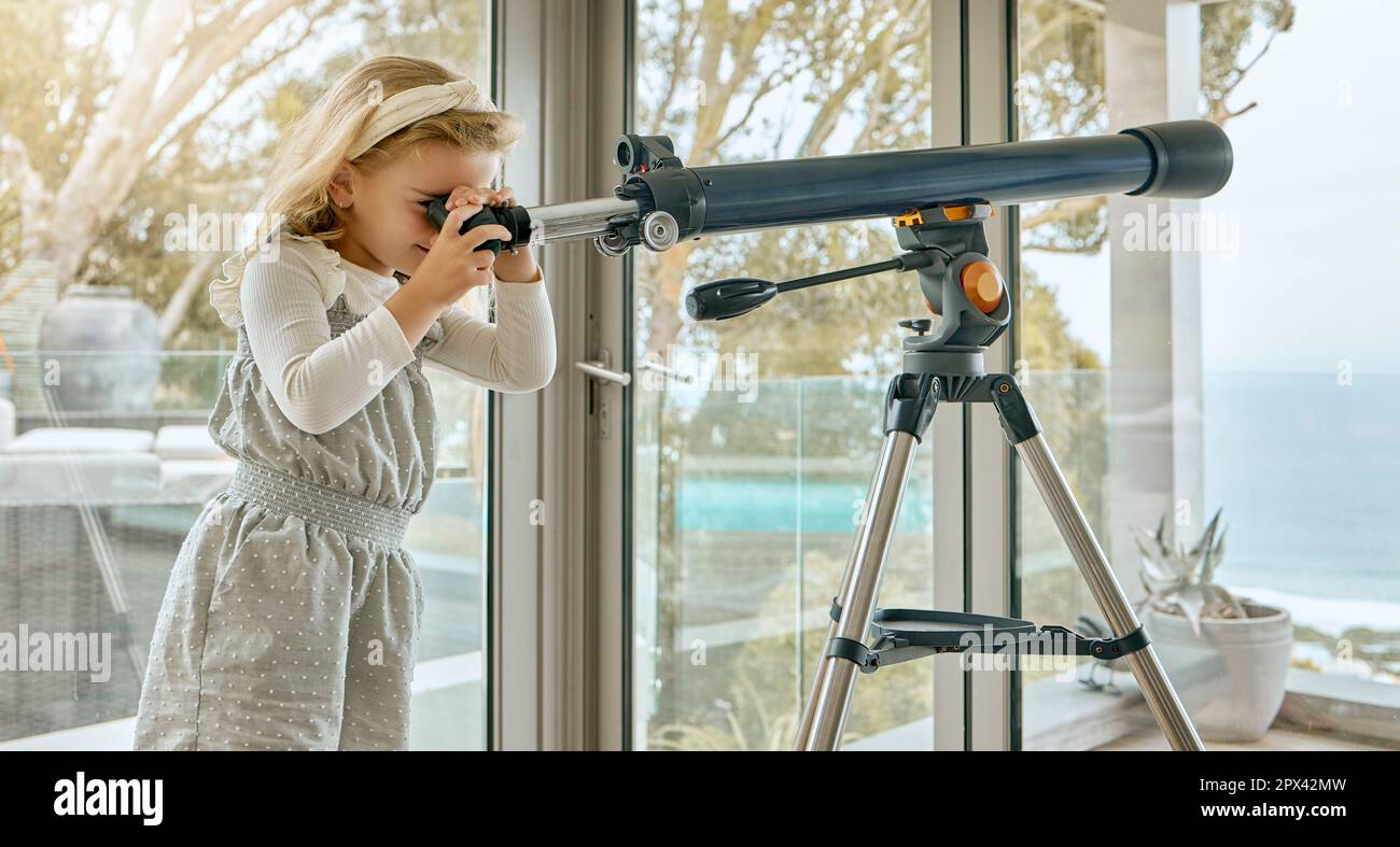 Children looking through telescope in hi-res stock photography and ...