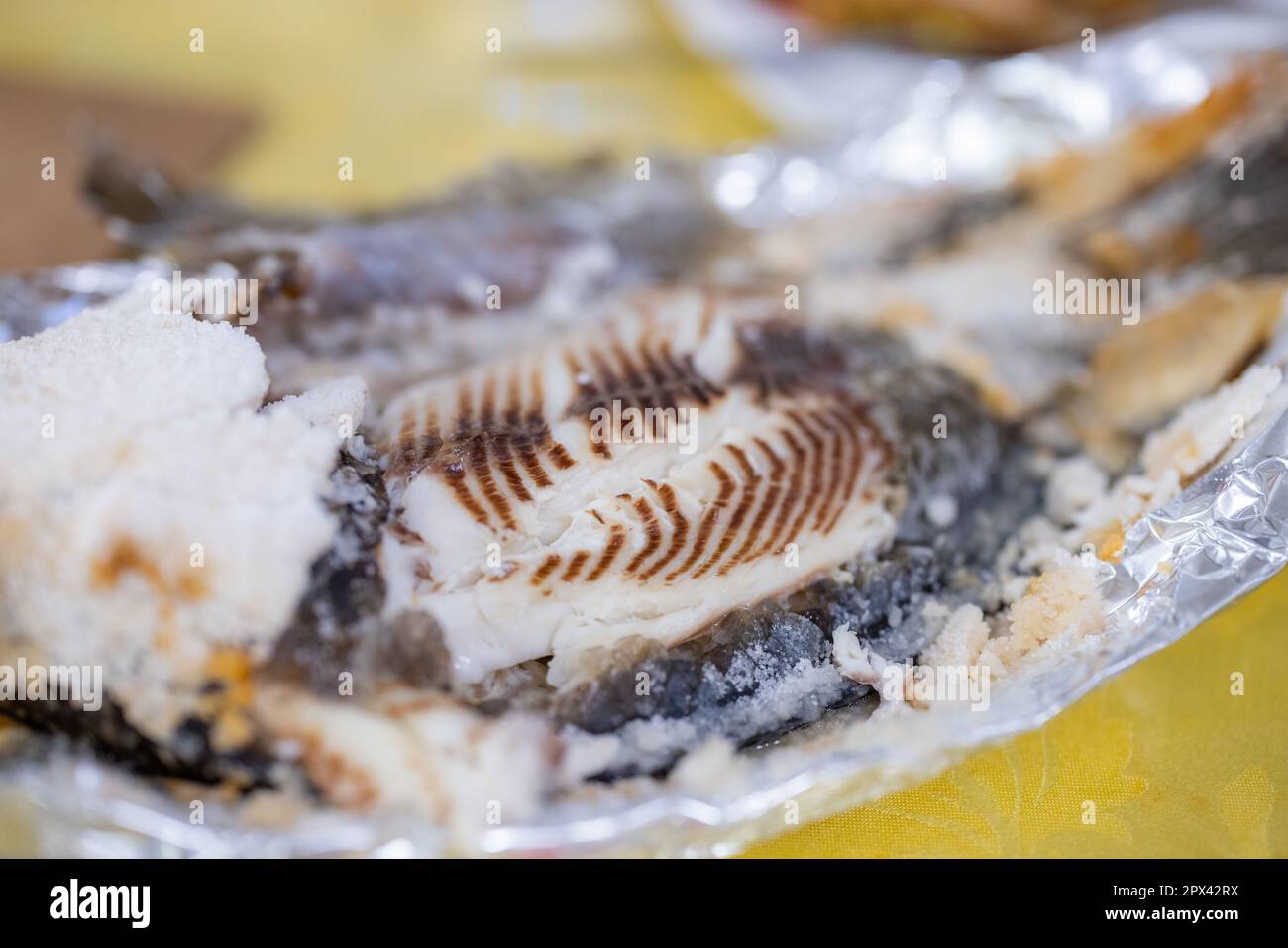 Fish baked in salt dish Stock Photo - Alamy