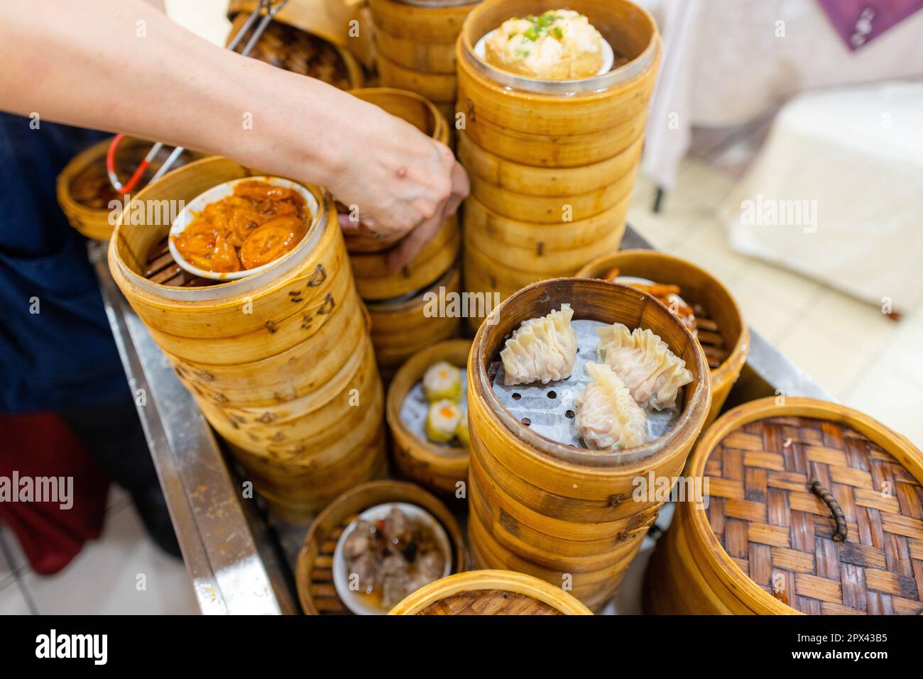 Group dim sum in dim sum basket on the cart Stock Photo - Alamy