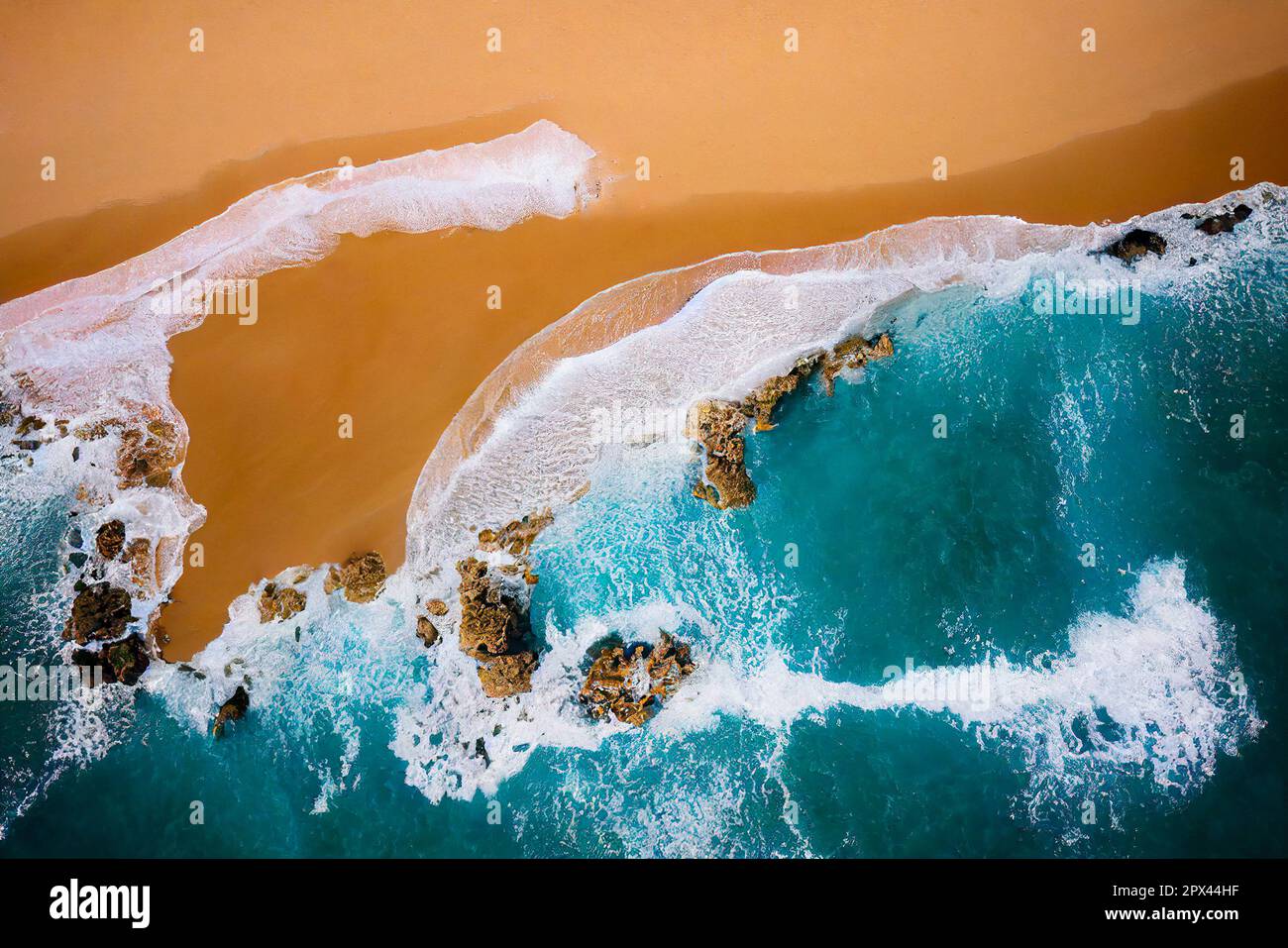 Aerial Top Down View of a Sandy Beach Coastline with Splashing Waves ...