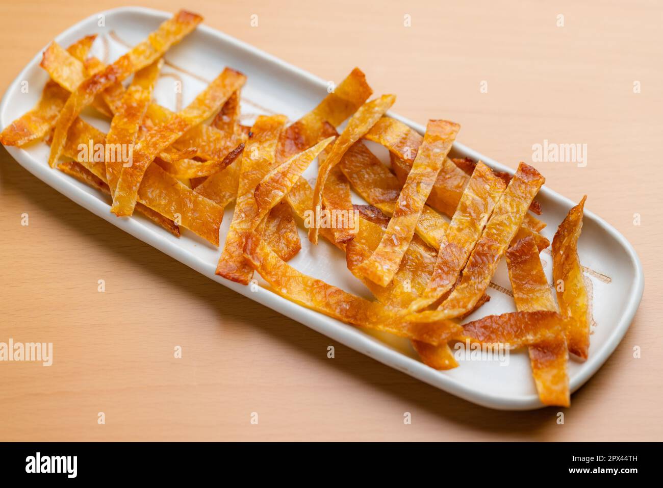 Cooked dried fish fillet snack Stock Photo - Alamy