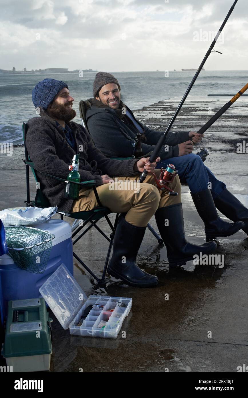 Fishing - The perfect way to cut loose and chill. two young men fishing ...