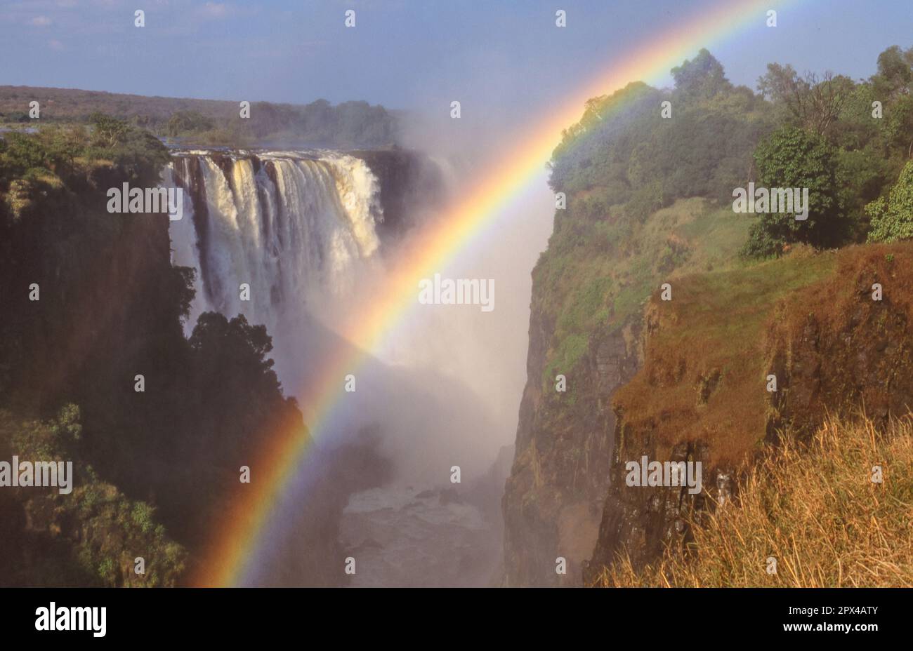 A rainbow over Victoria Falls, with both the Zimbabwean and Zambian ...