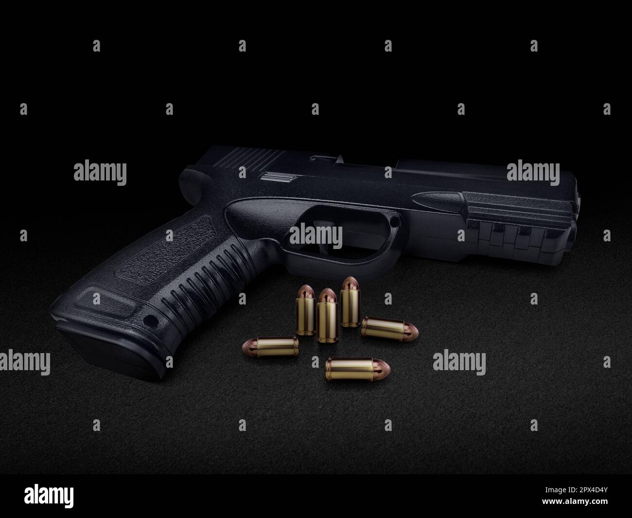 Gun with ammunition on black background Stock Photo - Alamy