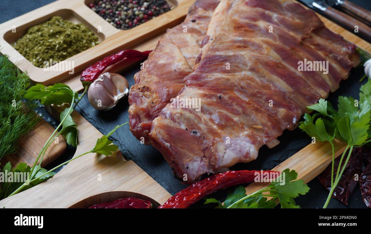 Two racks of smoked pork ribs with spices and herbs Stock Photo - Alamy