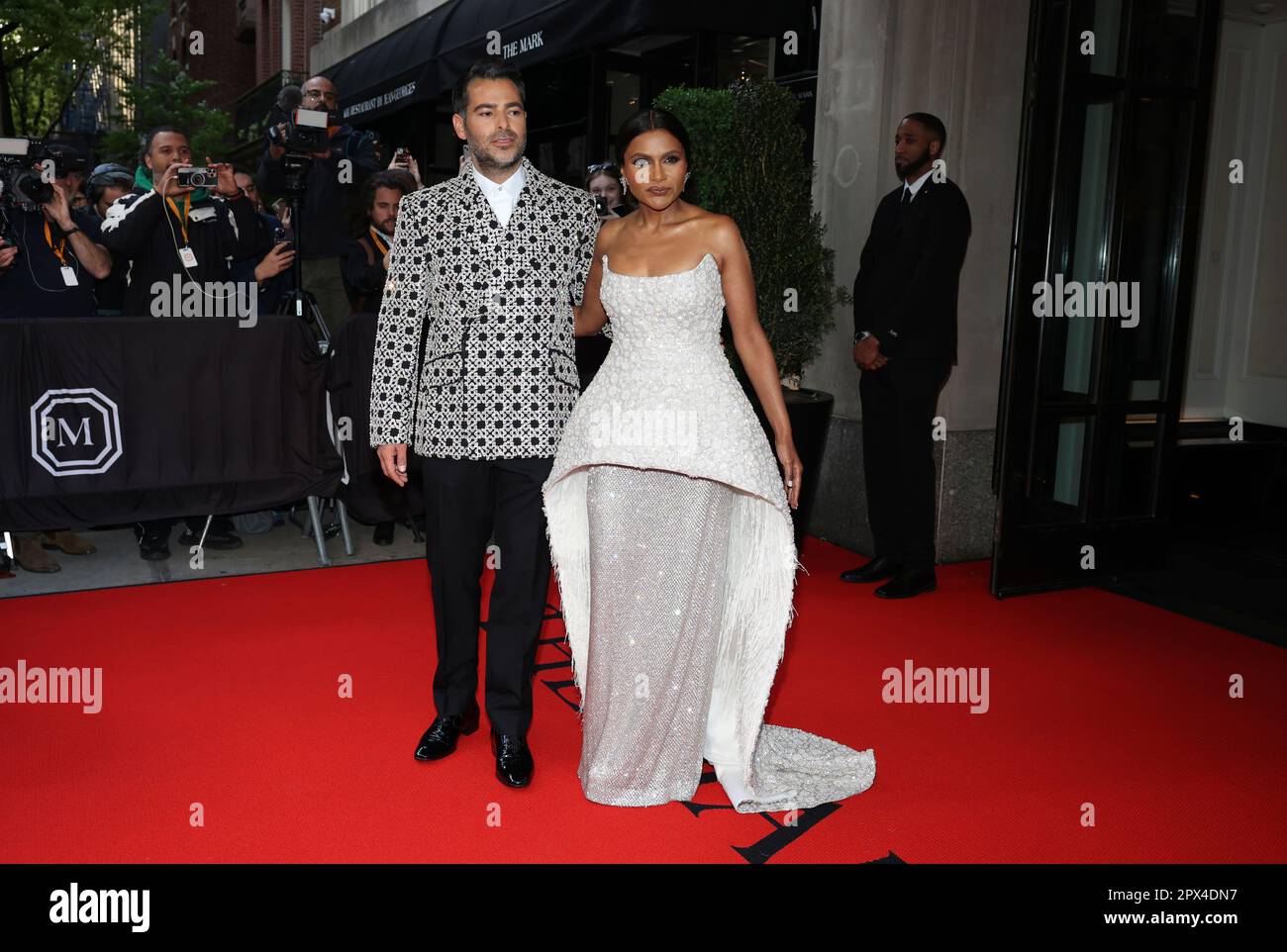 Jonathan Simkhai, left, and Mindy Kaling depart The Mark Hotel prior to ...