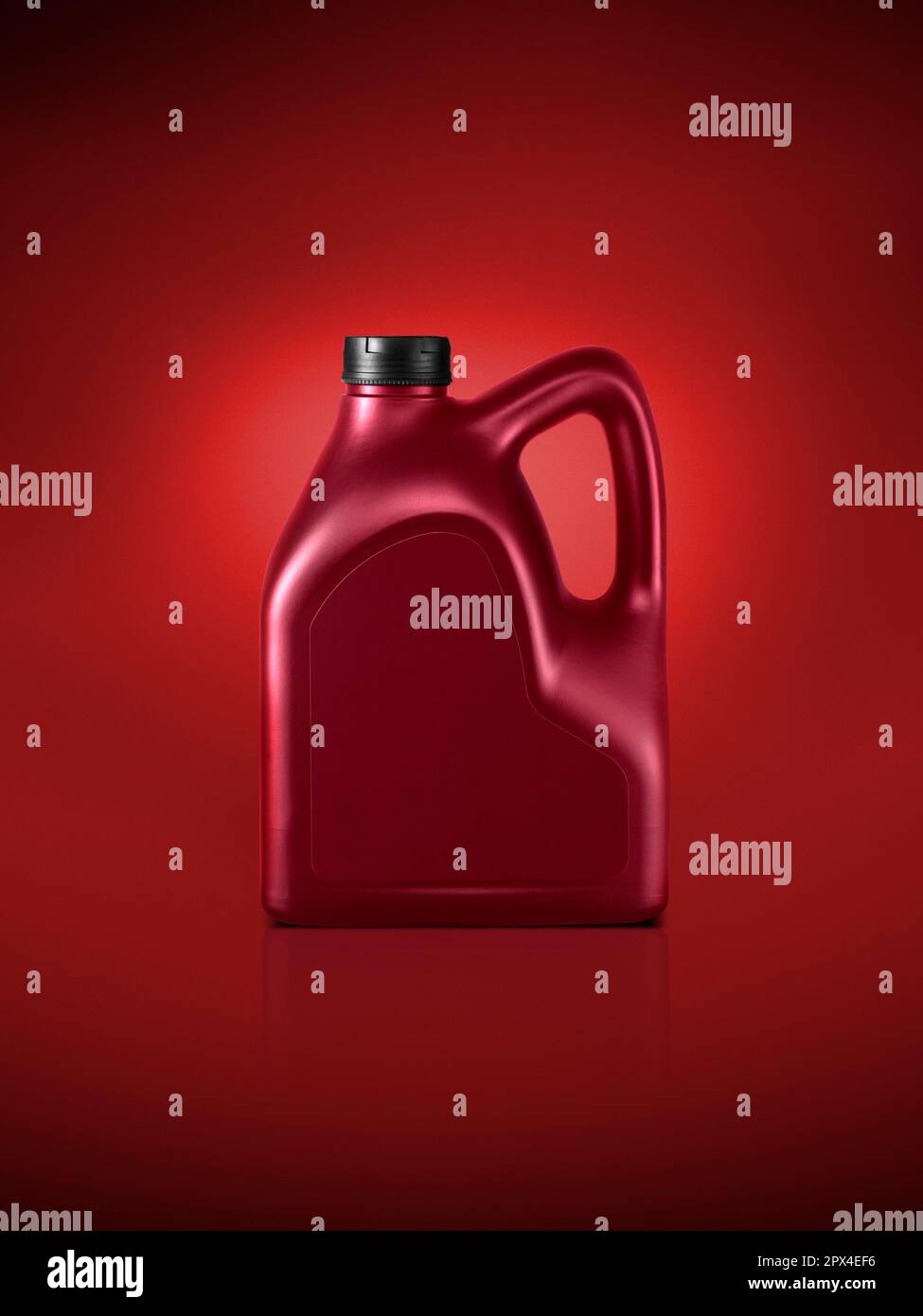 Gallon of engine oil on a dark red background Stock Photo - Alamy