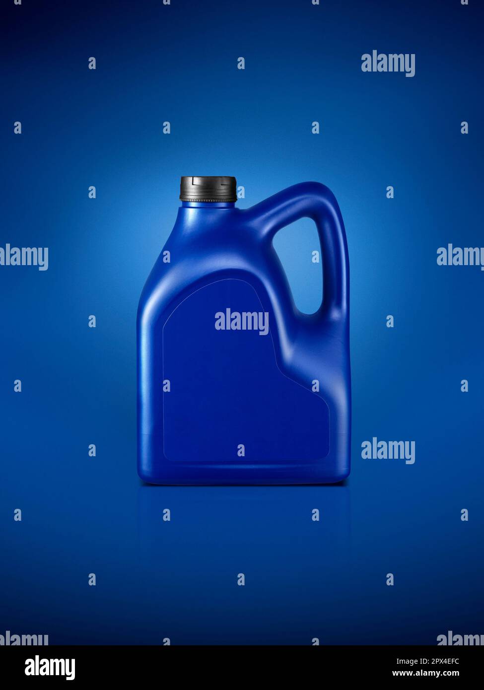 Gallon of engine oil on a dark blue background Stock Photo - Alamy